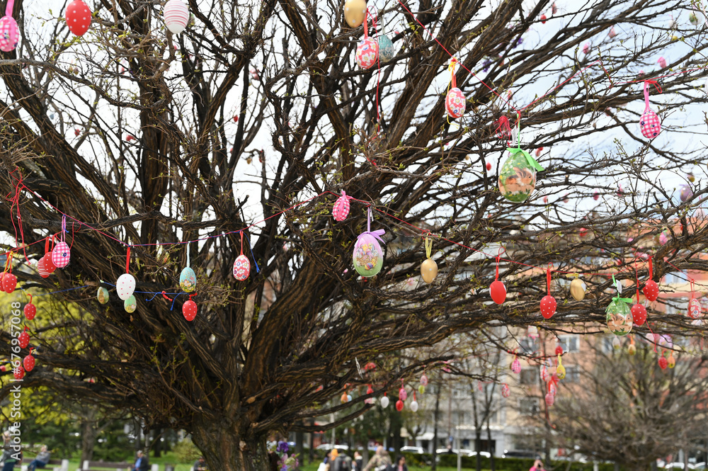 Large tree decorated with illuminated garlands of burning light bulbs ...