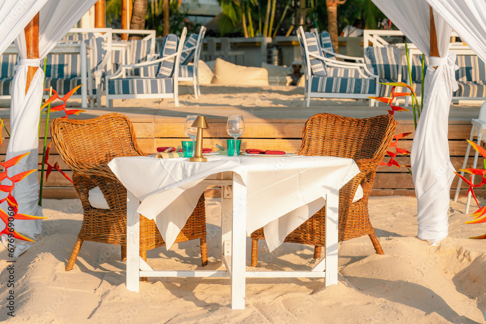 Luxury resort hotel outdoor restaurant on the beach, tropical island ...