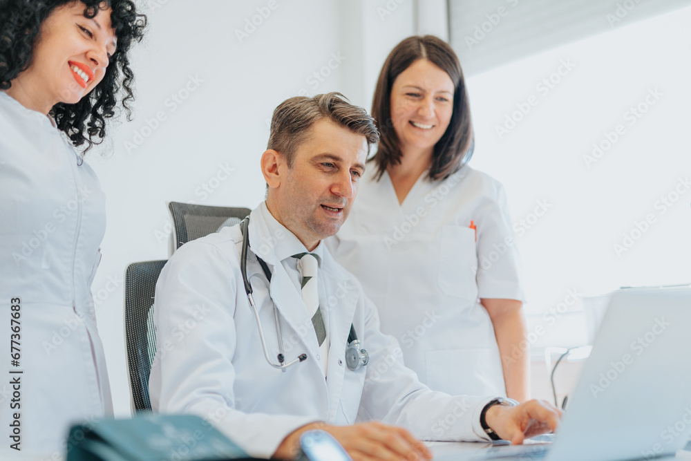 Doctor and nurses discussing diagnostic test results, providing ...