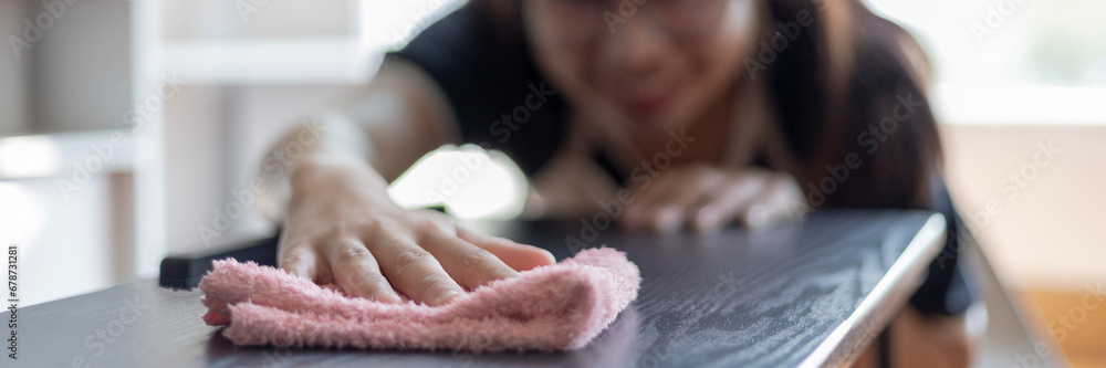 Housewife is cleaning things or Wipe down and dining table in the house ...
