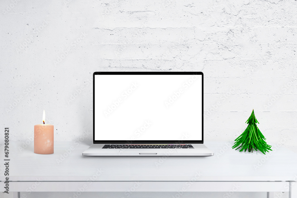 Laptop mockup on desk with Christmas decor, tree, and calendar. Cozy ...