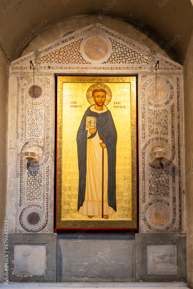 Medieval catholic saint portraited on a golden background decorating ...