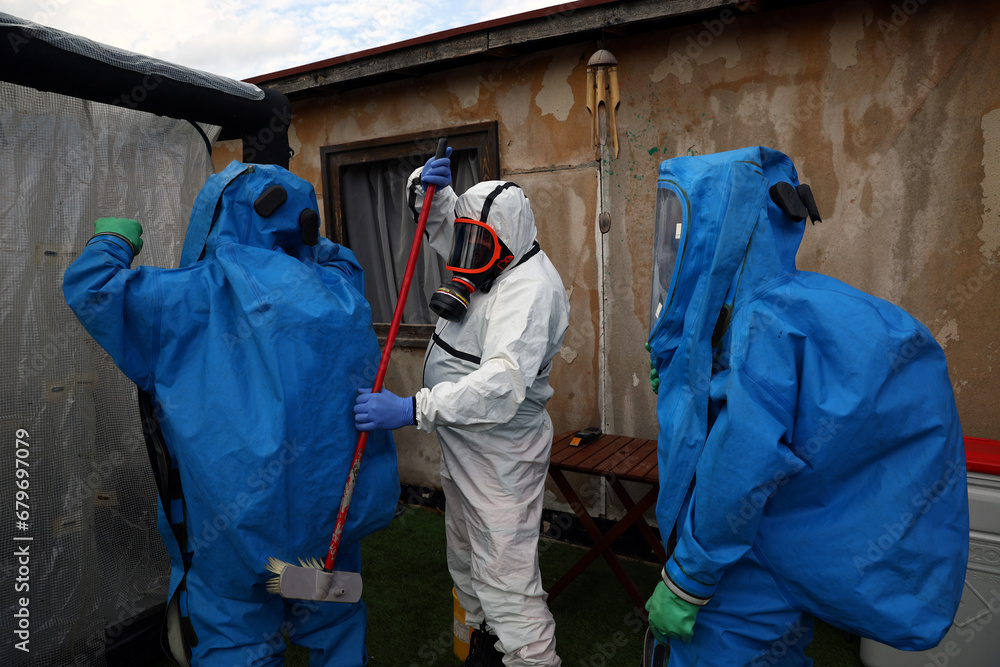 People wear Personal protective equipment (PPE) with gas mask for ...