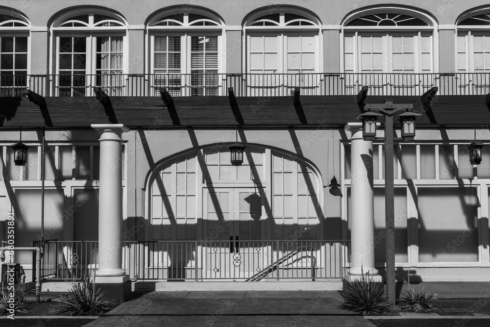 Side view of historic two story building in black and white photography ...