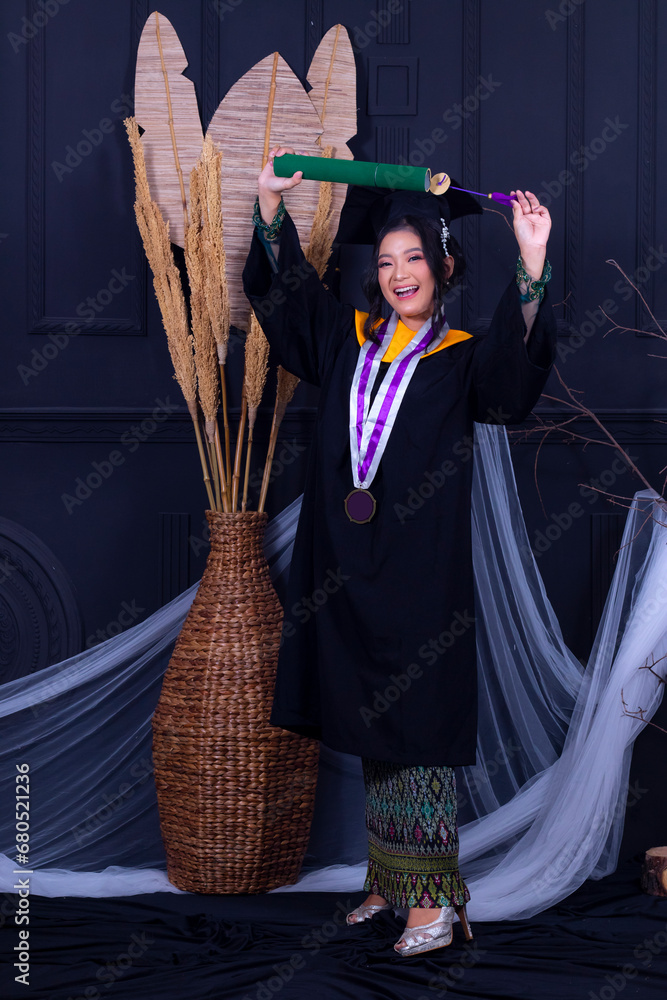 Photo Stock Beautiful mature Asian girl graduating, smiling happily ...