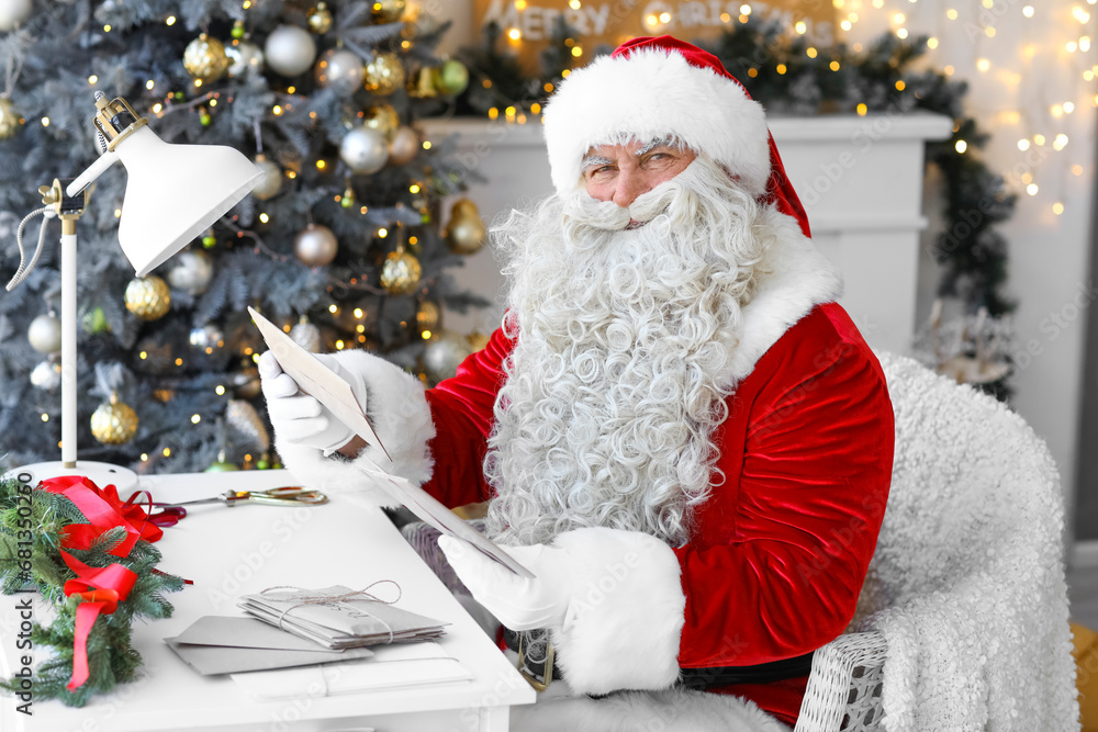 Santa Claus with letters at home on Christmas eve Stock Photo | Adobe Stock