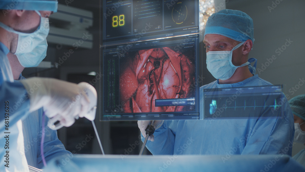 Foto de Stock Surgeons operate patient in modern hospital operating ...