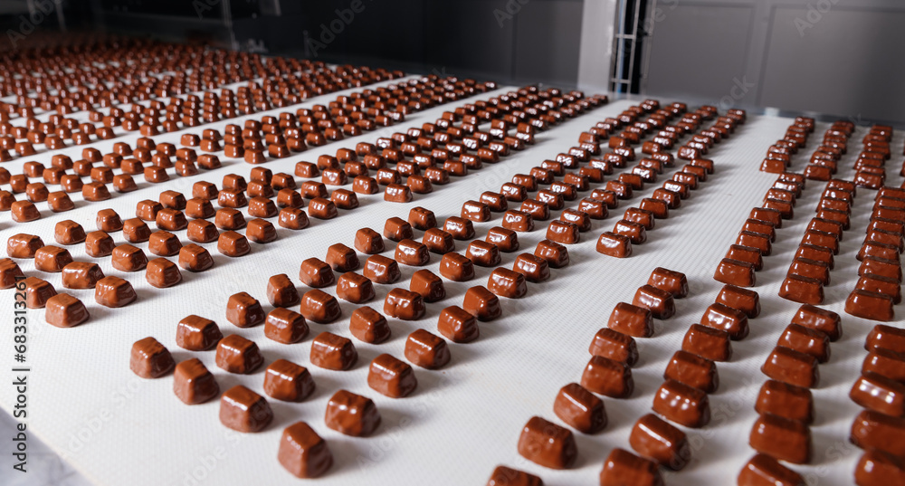 Process chocolate glazing sweets candy on conveyor automatic line ...