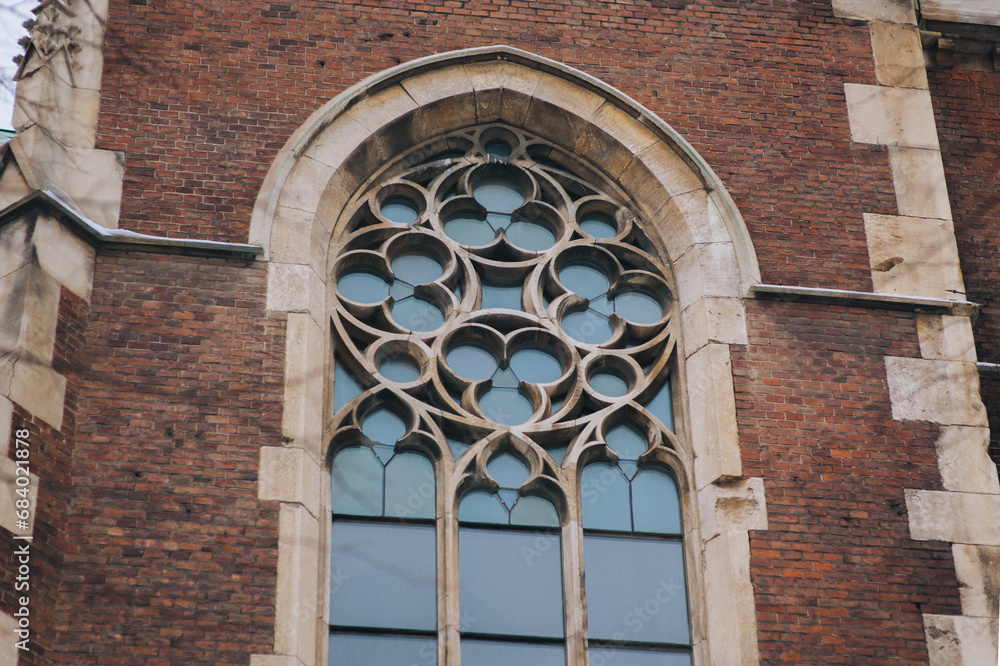 Elongated lafge vintage vertical window on the facade of the ancient ...