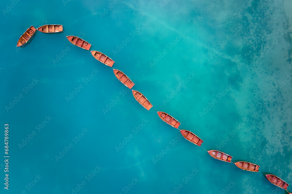 An artistic, perpendicular view of an axis shape made of wooden boats ...