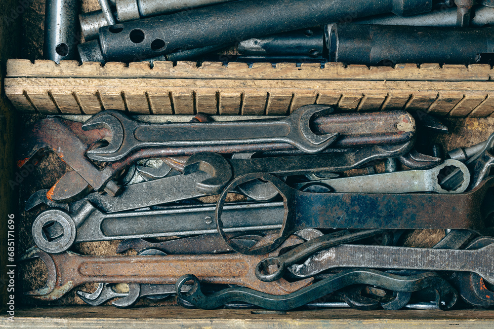 Wooden tool box of hand tools with old and dirty, rusty wrenches, ring ...