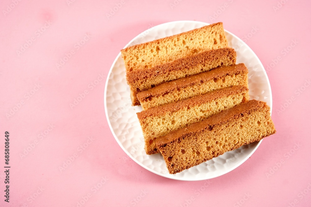 Homemade Indian cake rusk | Dry biscuits isolated on pink background ...