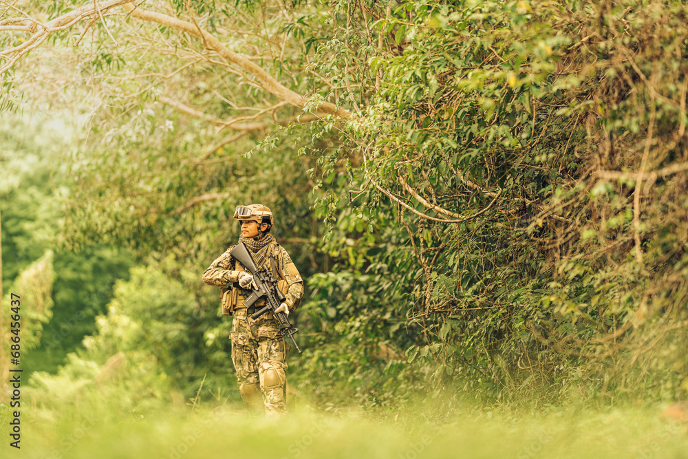 Stock-Foto „American soldiers are walking on the battlefield, around ...