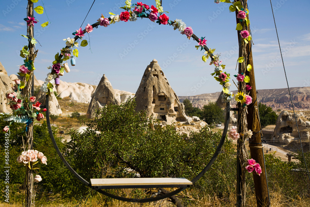 View through circular swing seat of Cave Houses near Goreme, Pigeon ...