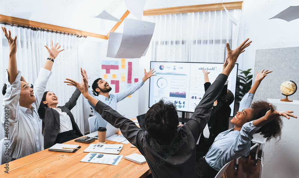 Group of office worker celebrate in meeting room, throwing paperwork in ...
