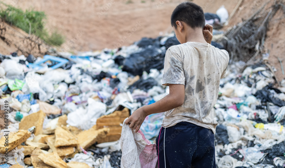 Poor children on the garbage dump and selecting plastic waste to sell ...