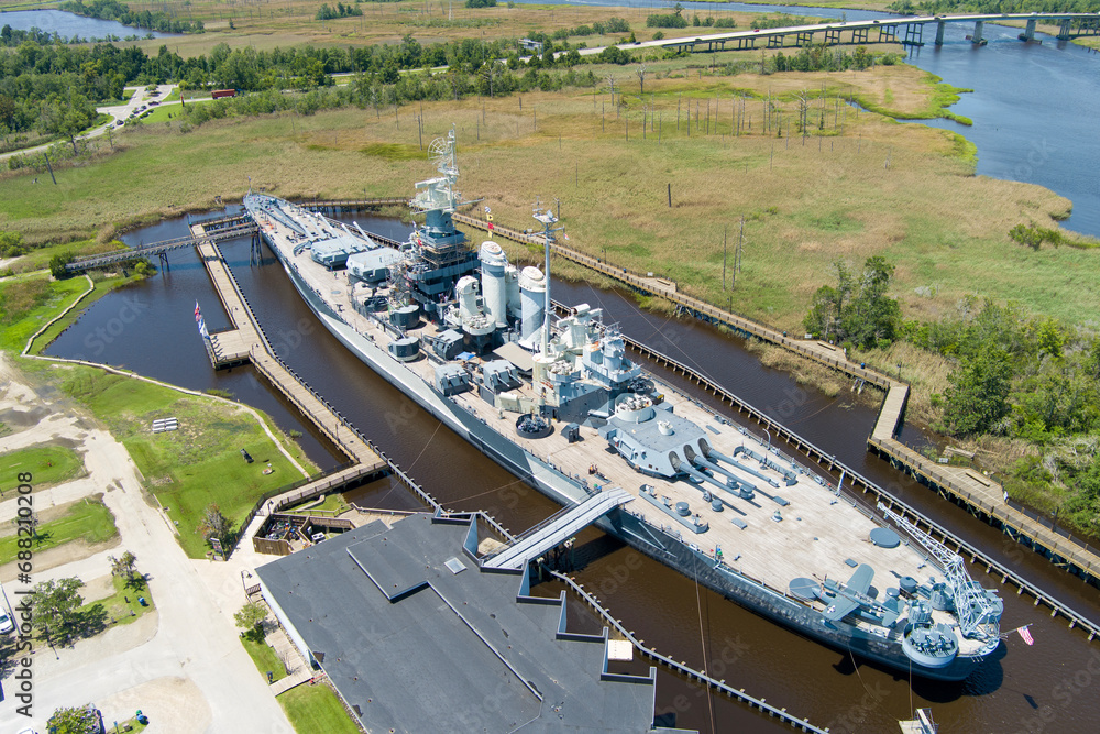 aerial shot of the USS North Carolina Battleship docked along Cape Fear ...