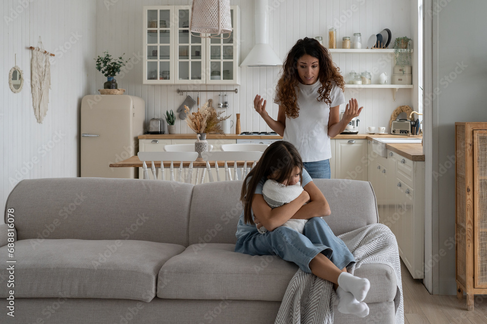 Angry woman mom blaming scolding sad guilty teenage daughter at home ...