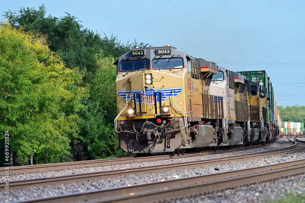 Multiple locomotives lead a Union Pacific intermodal freight train ...