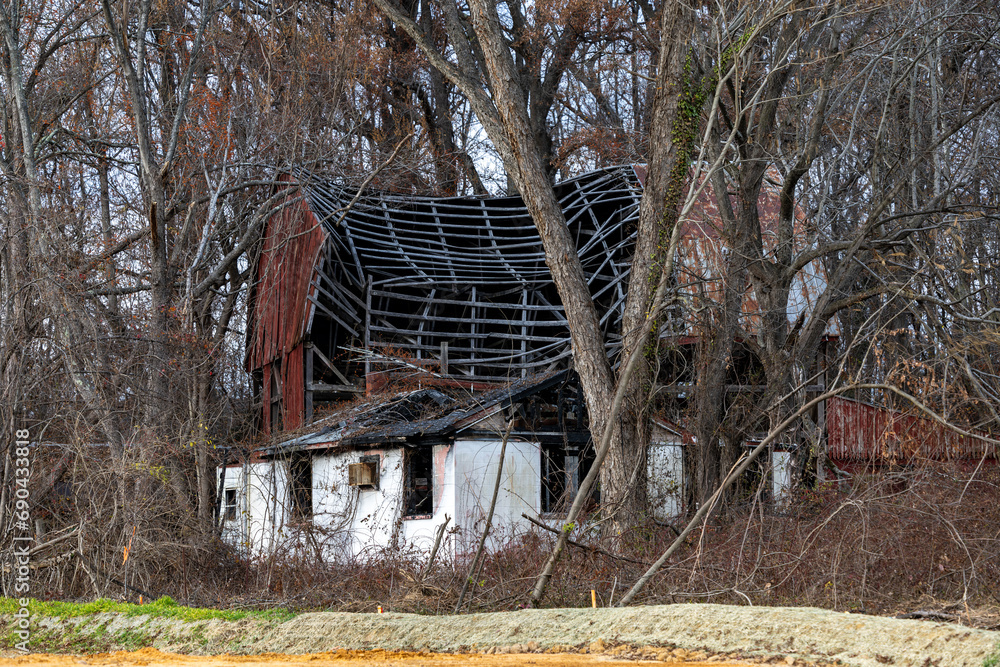 Prince Frederick, Maryland USA A dilapidated barn in the woods witha ...