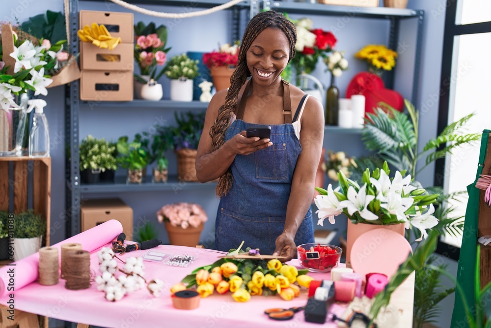 African american woman florist make photo by smartphone to bouquet of ...
