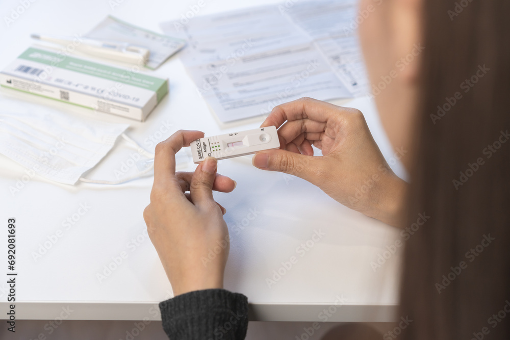 Pandemic of disease, asian young woman, girl hand show holding atk ...