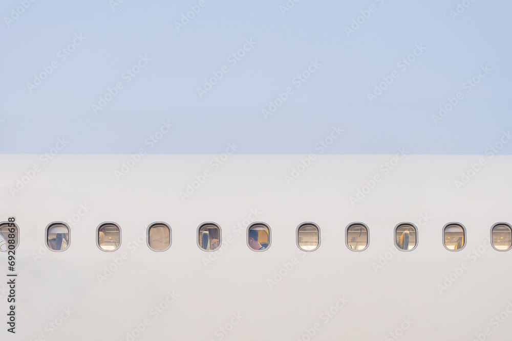 Row of Airplane Windows on Fuselage Stock Photo | Adobe Stock
