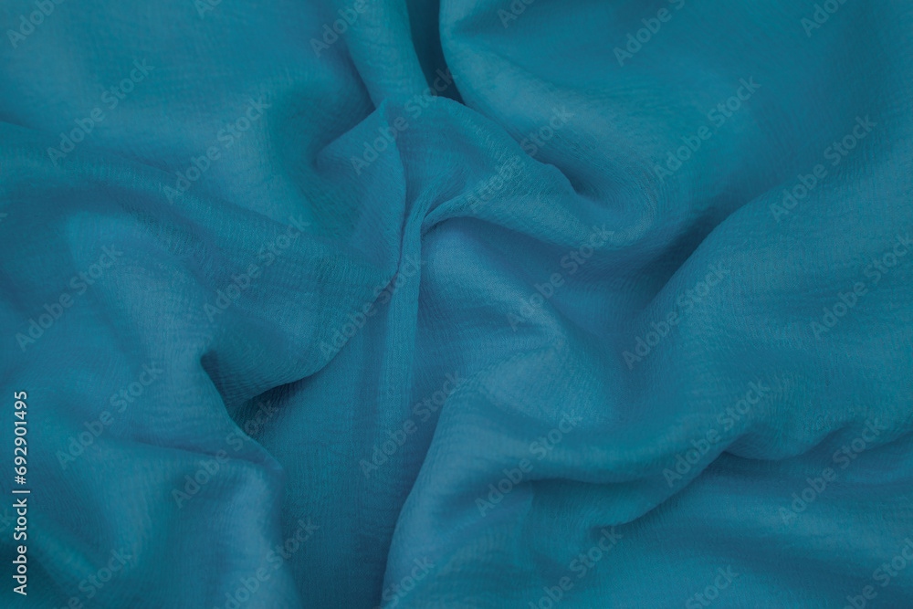 AI generated illustration of a close-up of a turquoise fabric material ...
