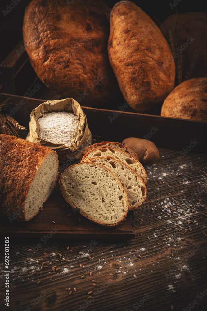 Whole and sliced breads Stock Photo | Adobe Stock