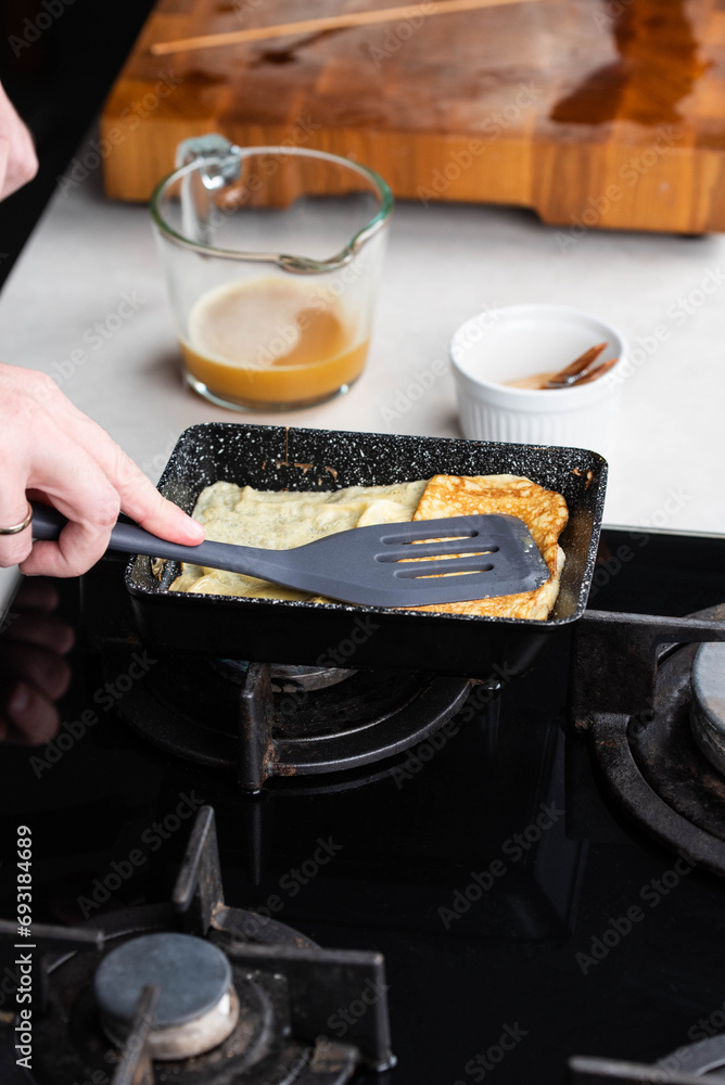 Chef man hands cooking Tamagoyaki or Tamago traditional Japanese Rolled ...