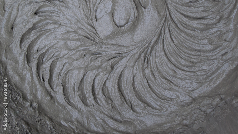 Wet gray mortar mix for finishing work in construction. Traces of mixer ...