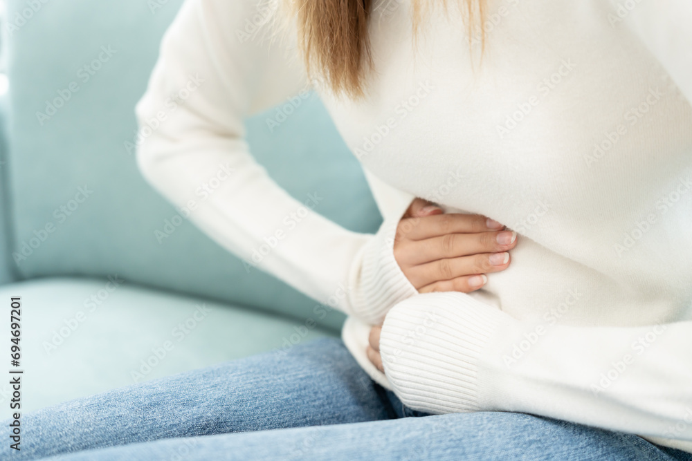 stomach ache. Asian women have abdominal pain, indigestion, gastritis, menstrual cramps ...