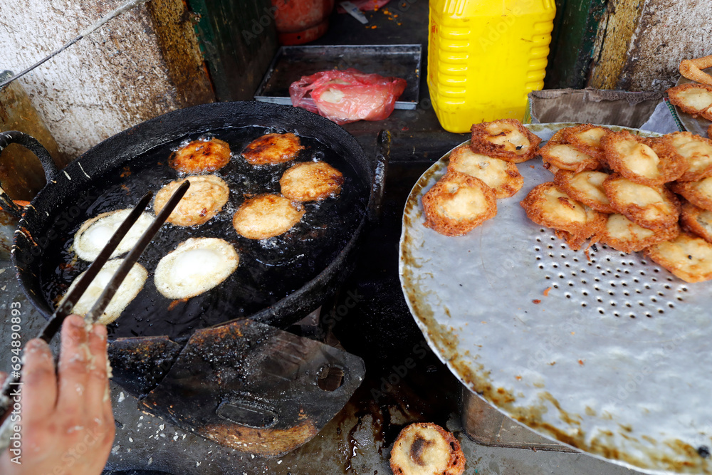 Traditional Nepalese restaurant, fried Sel Roti, the traditional ...