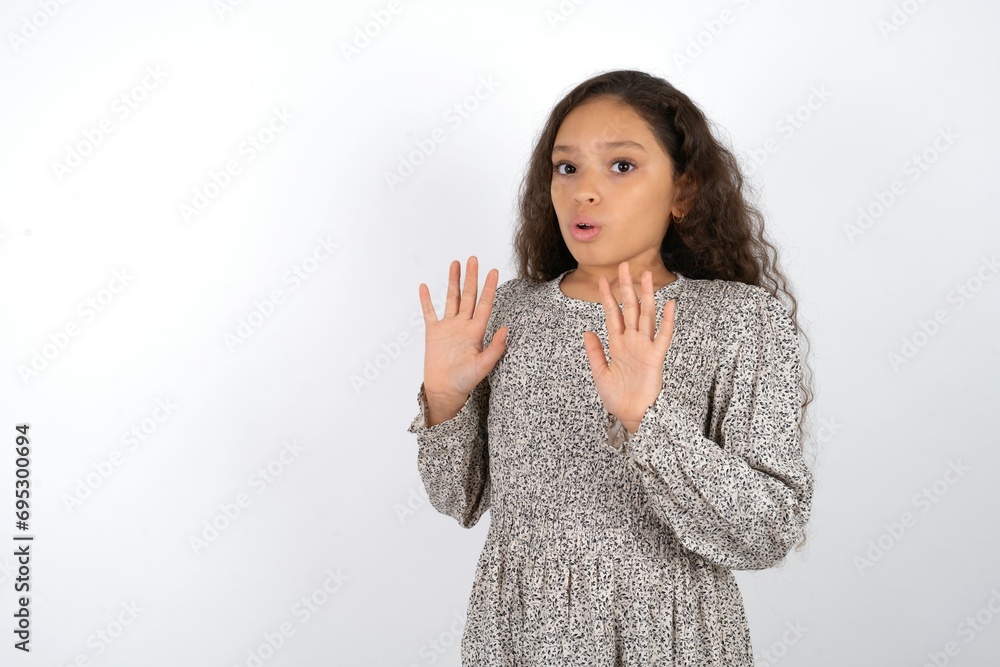 Beautiful teenager girl Moving away hands palms showing refusal and ...