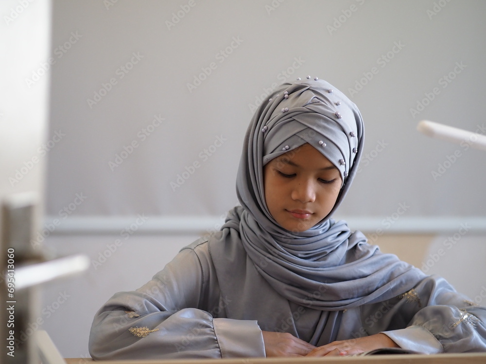 Preteen Muslim kid study in classroom.Portrait of Muslim student in ...