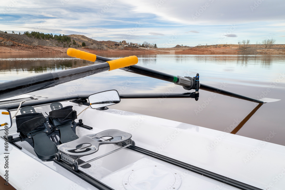 Detail of a coastal rowing shell with sculling oars, footstretcher ...