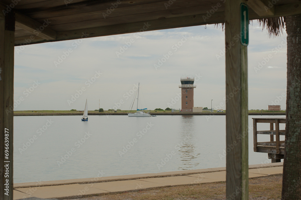View south out wood pavilion at Demens Landing Park. Through wood ...