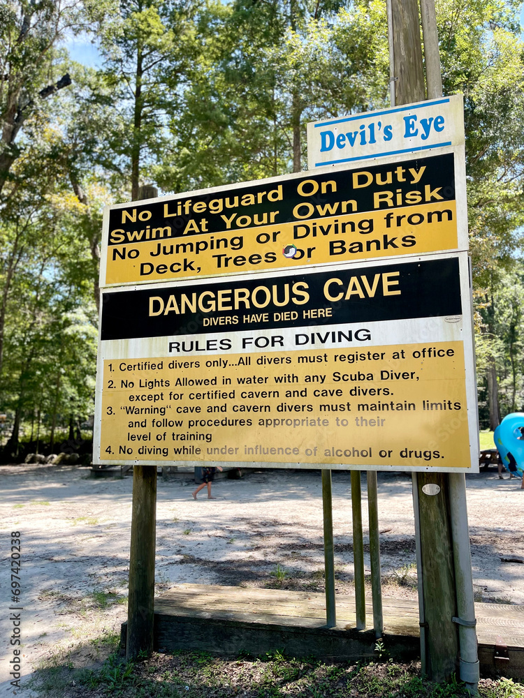 Warning sign warns divers and swimmers of dangerous caves in Devil's ...