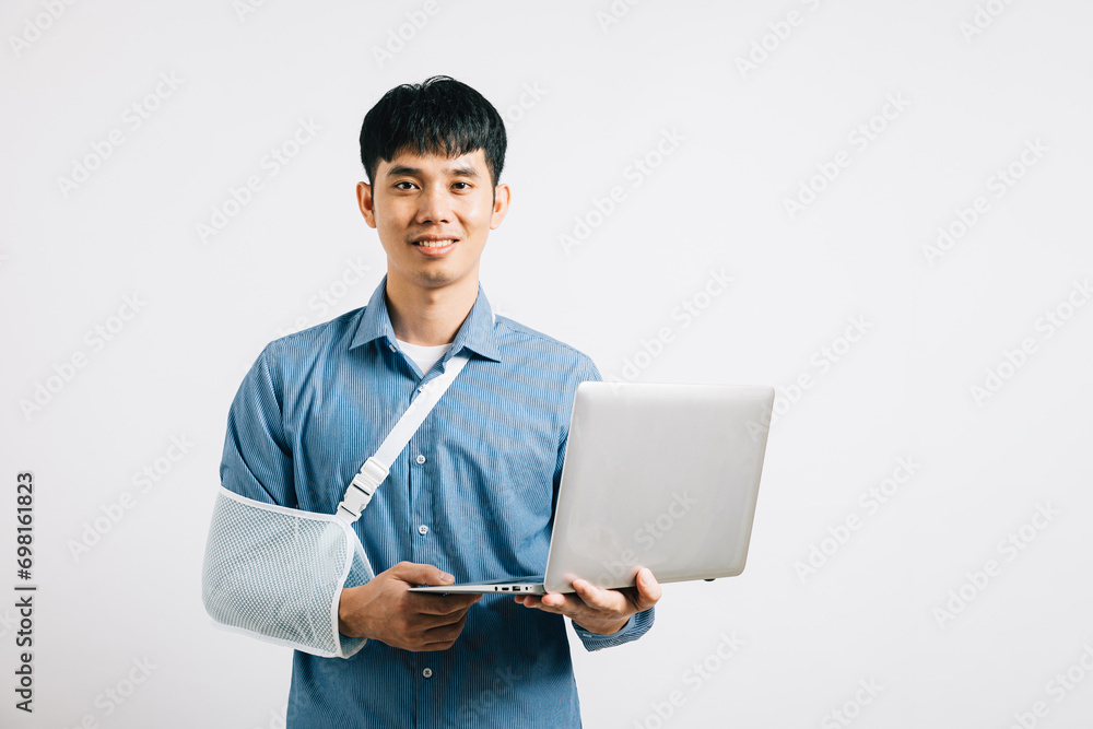 Despite a broken arm, an Asian businessman wears a splint, holding a ...