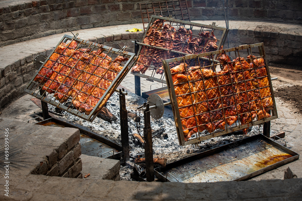 "Chancho al Palo" is a traditional Peruvian dish that involves roasting ...