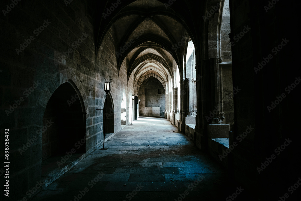 Interior corridor in ancient landmark building with gothic arch in a ...