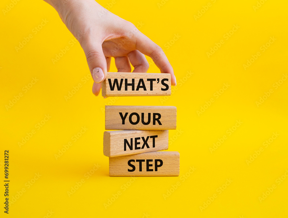 What is your next step symbol. Wooden blocks with words What is your ...