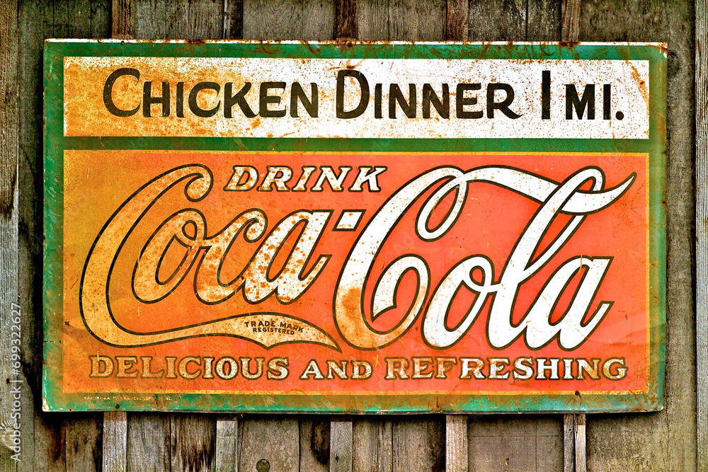 Coca Cola sign with “Chicken Dinner 1 Mile” header and the slogan ...