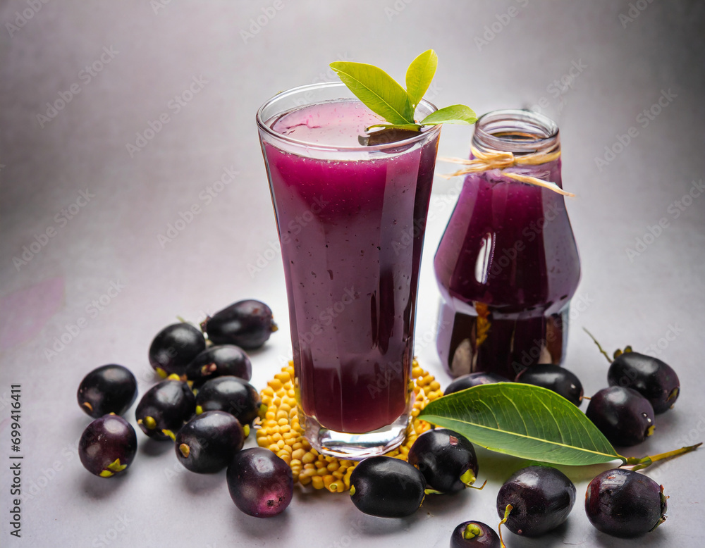 Juice of jamun fruit in a glass also called as java plum, jambolan plum ...