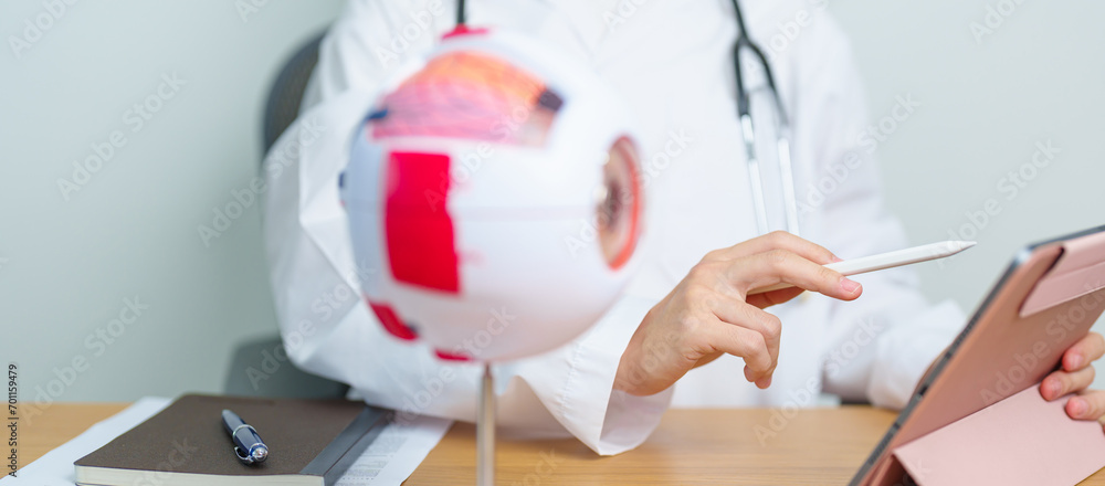 Doctor with human Eye anatomy model with magnifying glass. Eye disease ...