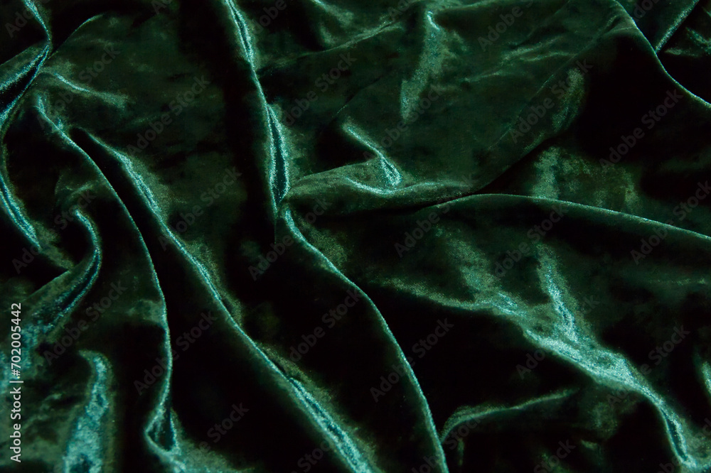 Shiny luxurious dark green velvet fabric. Rich elegant background for ...