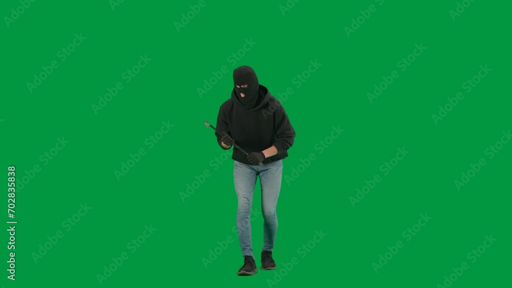 Portrait of thief on chroma key green screen background. Man robber in ...