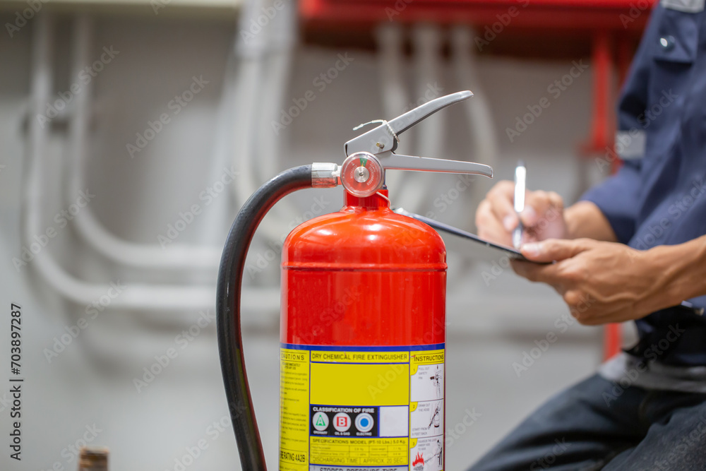 Engineer are checking and inspection a fire extinguishers tank in the ...