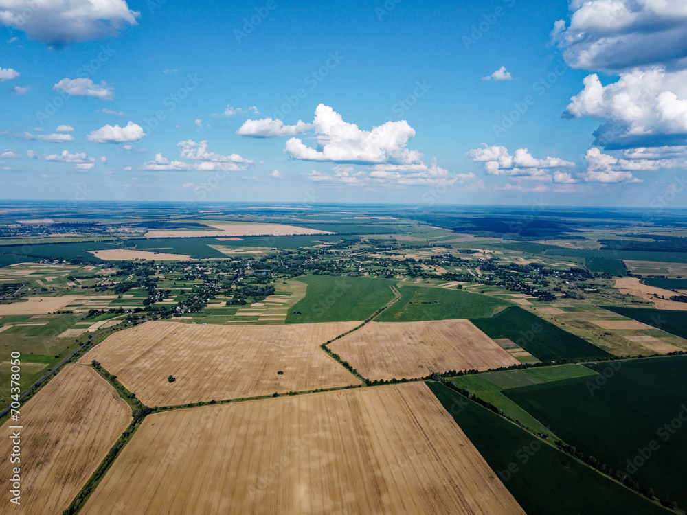 Beautiful agricultural landscape, open field with blue sky and white ...