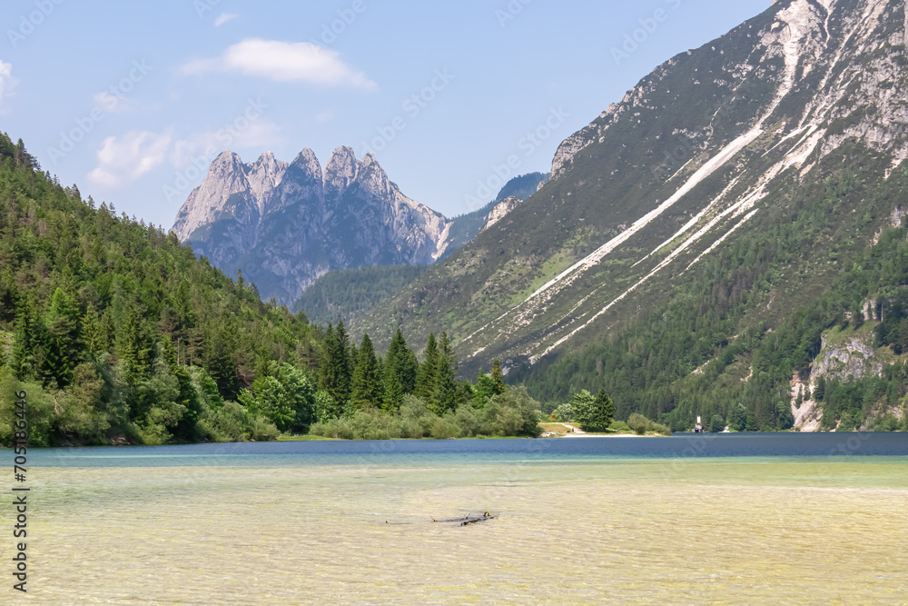 Scenery of Lake Predil with panoramic view of majestic mountain peak ...